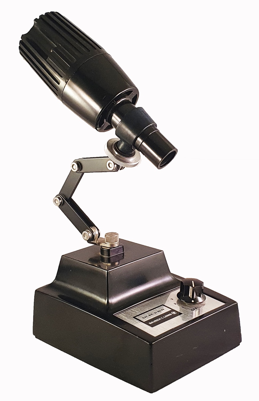 A black microscope with a long armDescription automatically generated