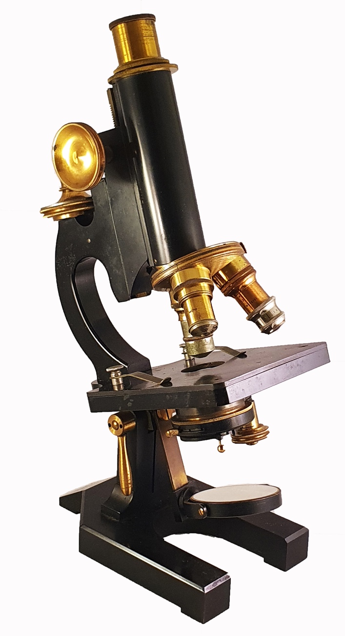 A close-up of a microscopeDescription automatically generated