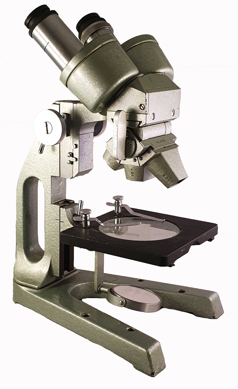 A close-up of a microscopeDescription automatically generated