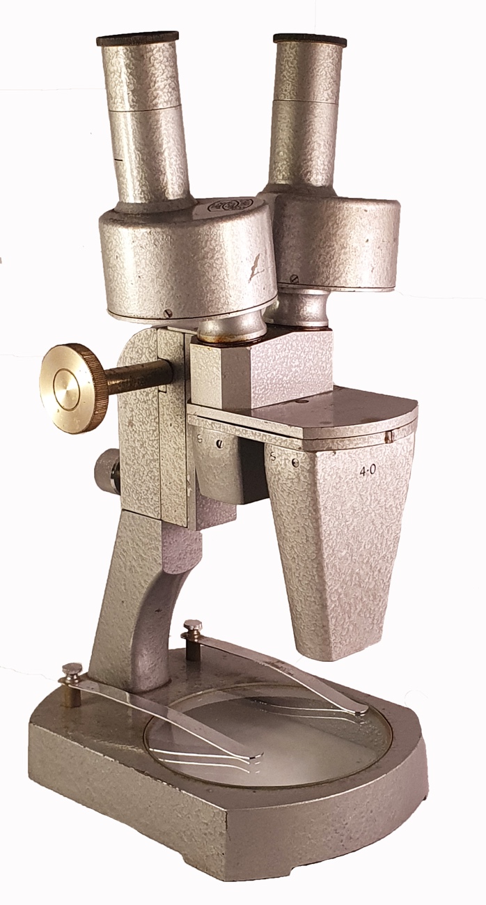 A close-up of a microscopeDescription automatically generated with ...