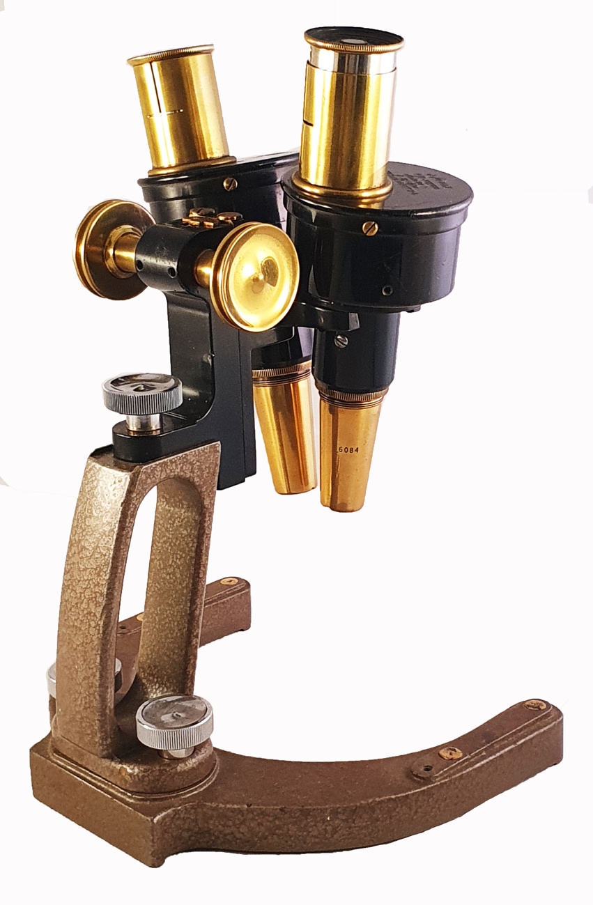 A close-up of a microscopeDescription automatically generated