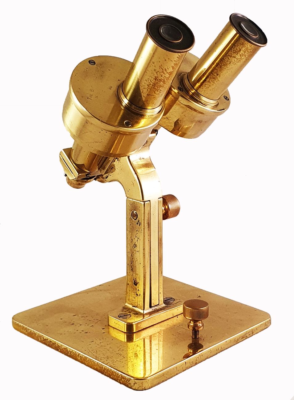 A close-up of a gold microscopeDescription automatically generated with ...