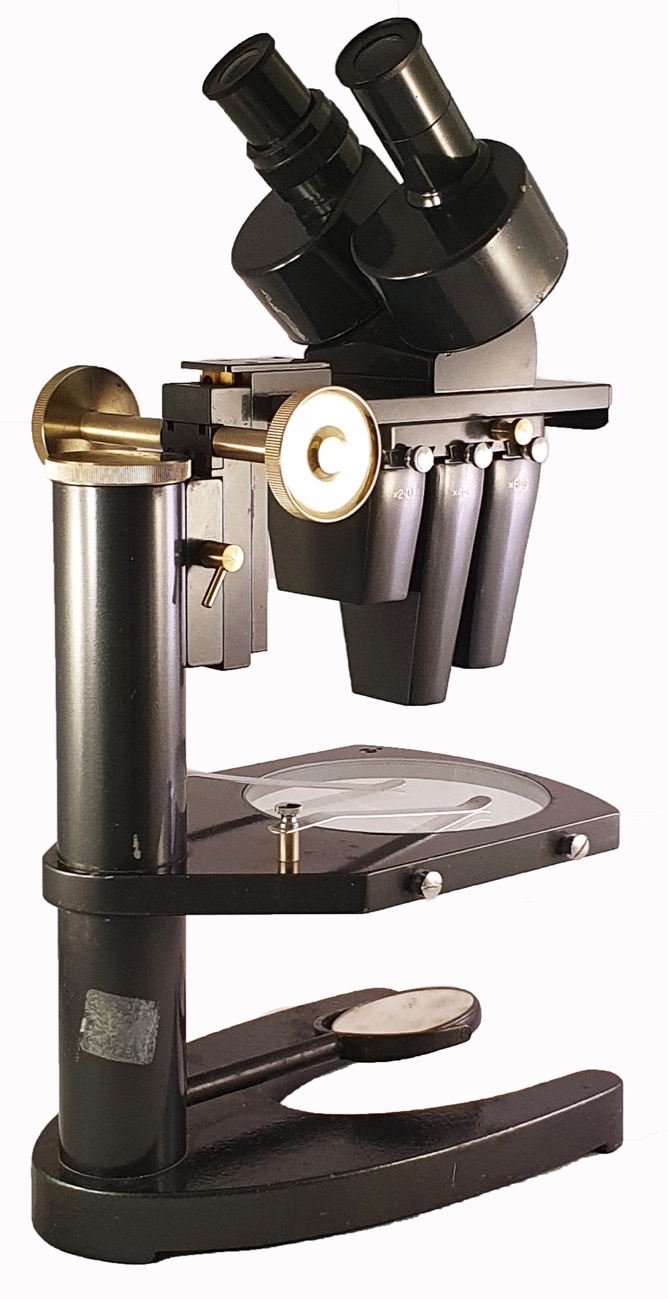 A close-up of a microscopeDescription automatically generated with ...