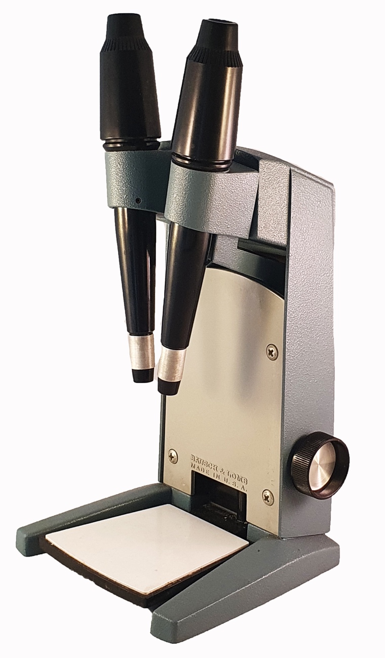 A close-up of a microscopeDescription automatically generated with ...