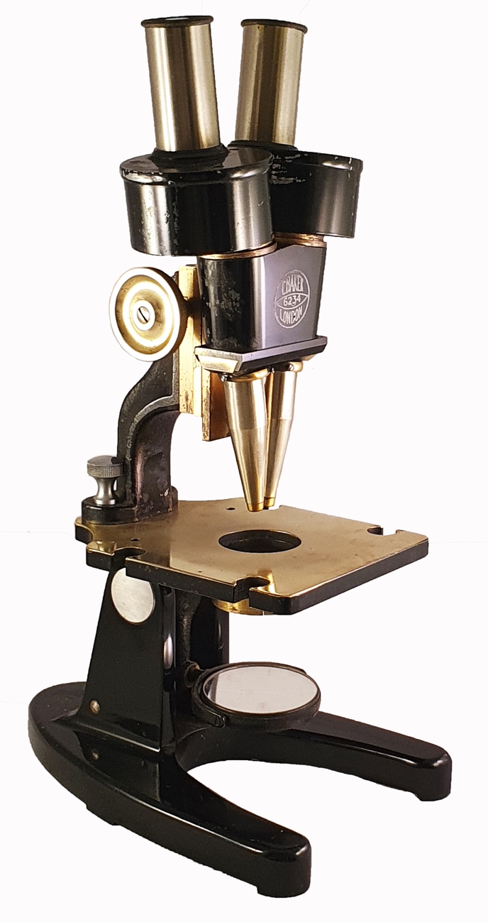 A close-up of a microscopeDescription automatically generated