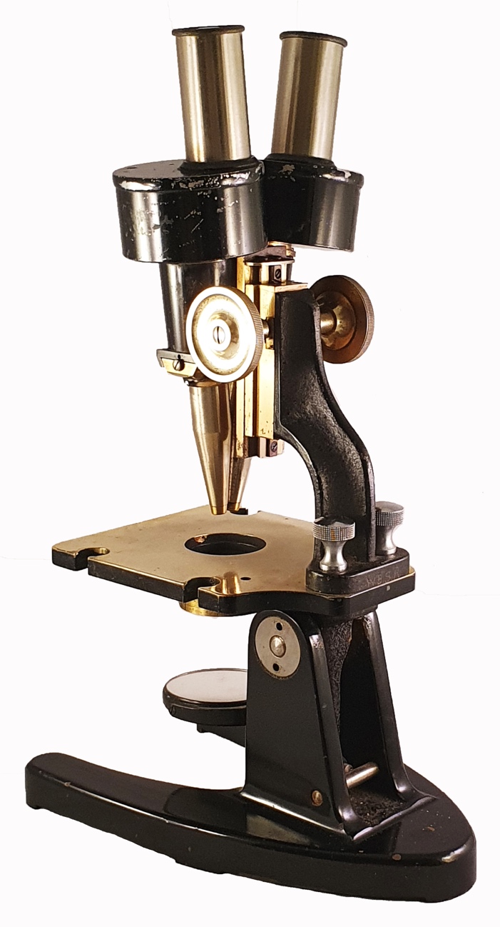 A close-up of a microscopeDescription automatically generated