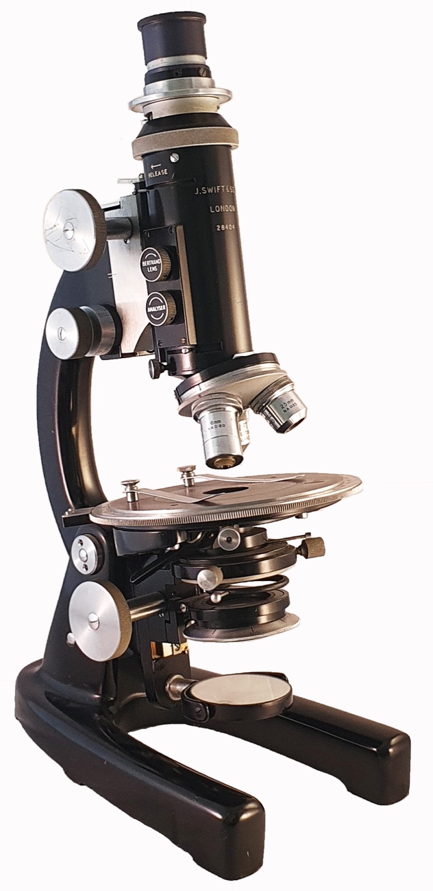 A close-up of a microscopeDescription automatically generated