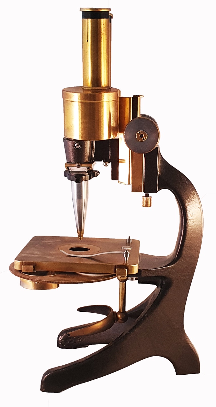 A close-up of a microscopeDescription automatically generated