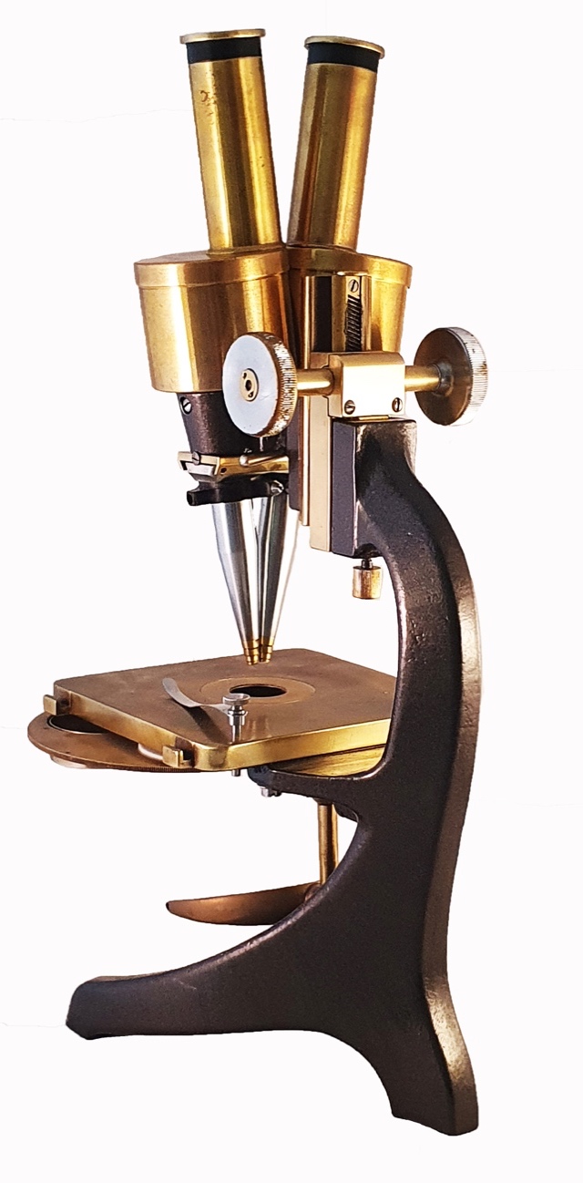 A close-up of a microscopeDescription automatically generated