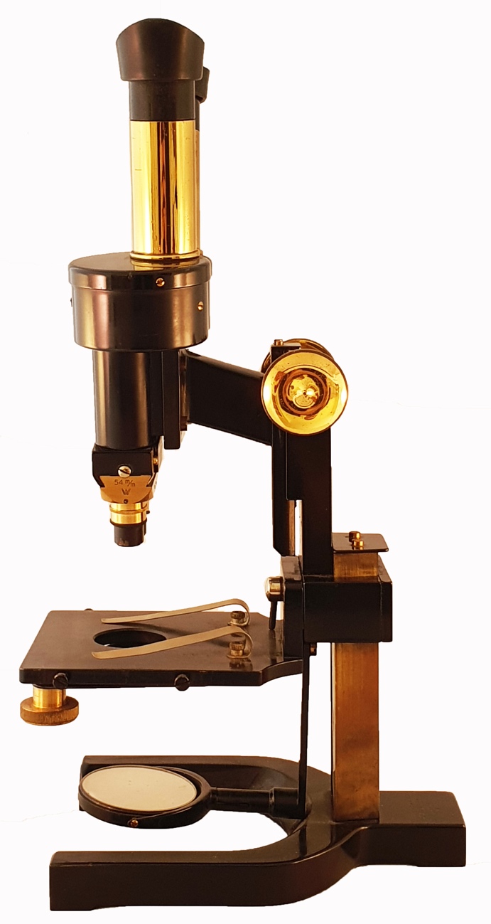 A close-up of a microscopeDescription automatically generated