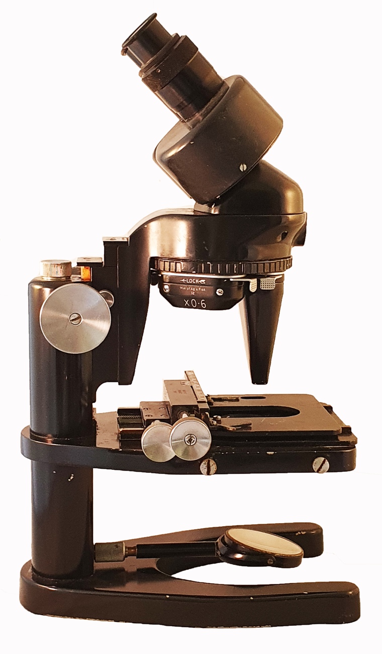 A close-up of a microscopeDescription automatically generated