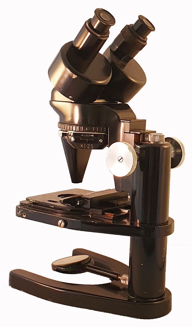 A close-up of a microscopeDescription automatically generated