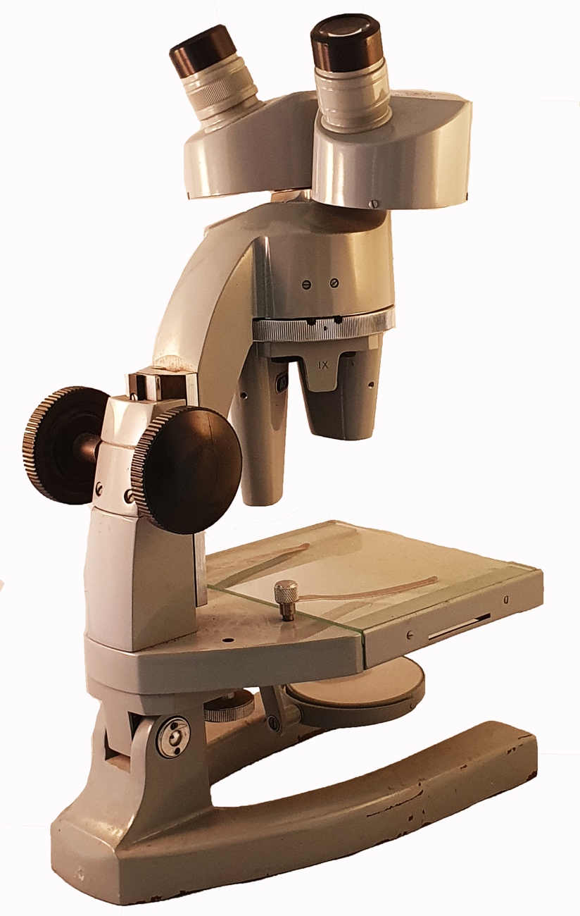 A close-up of a microscopeDescription automatically generated