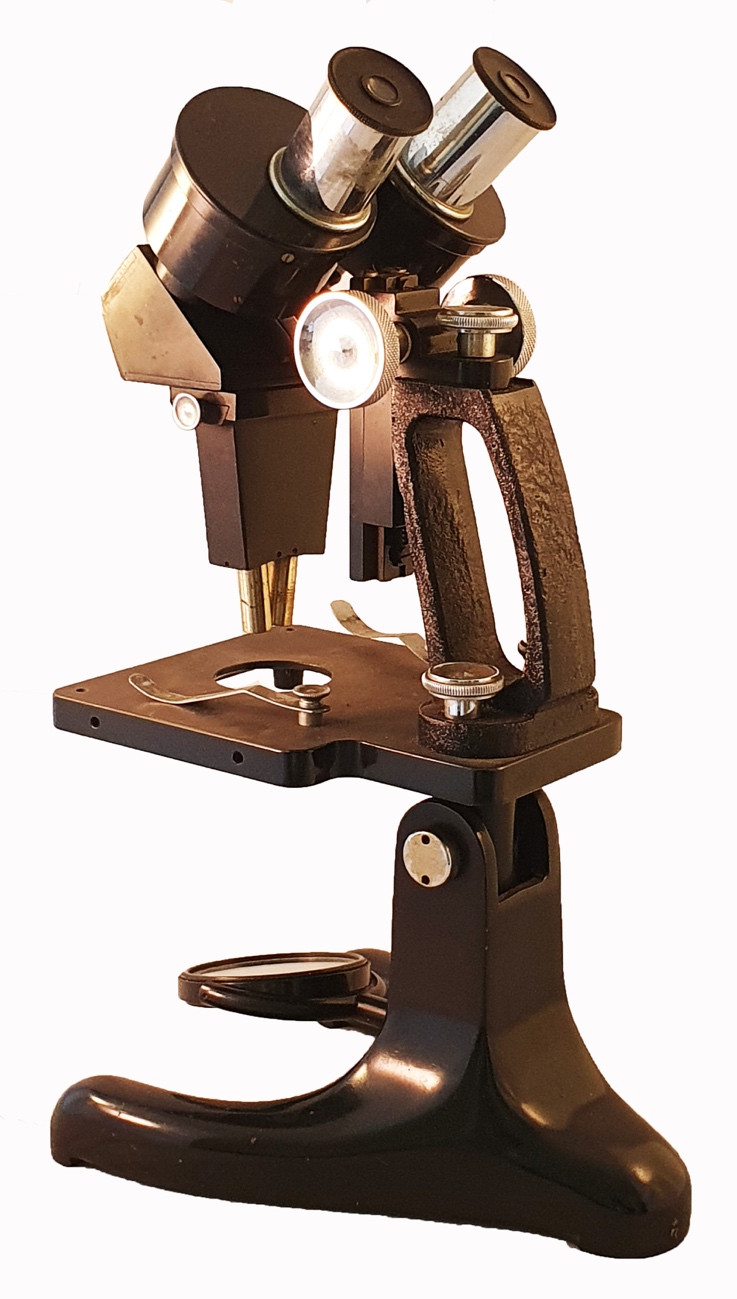 A close-up of a microscopeDescription automatically generated