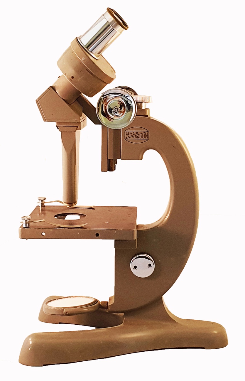 A brown microscope with a white backgroundDescription automatically ...
