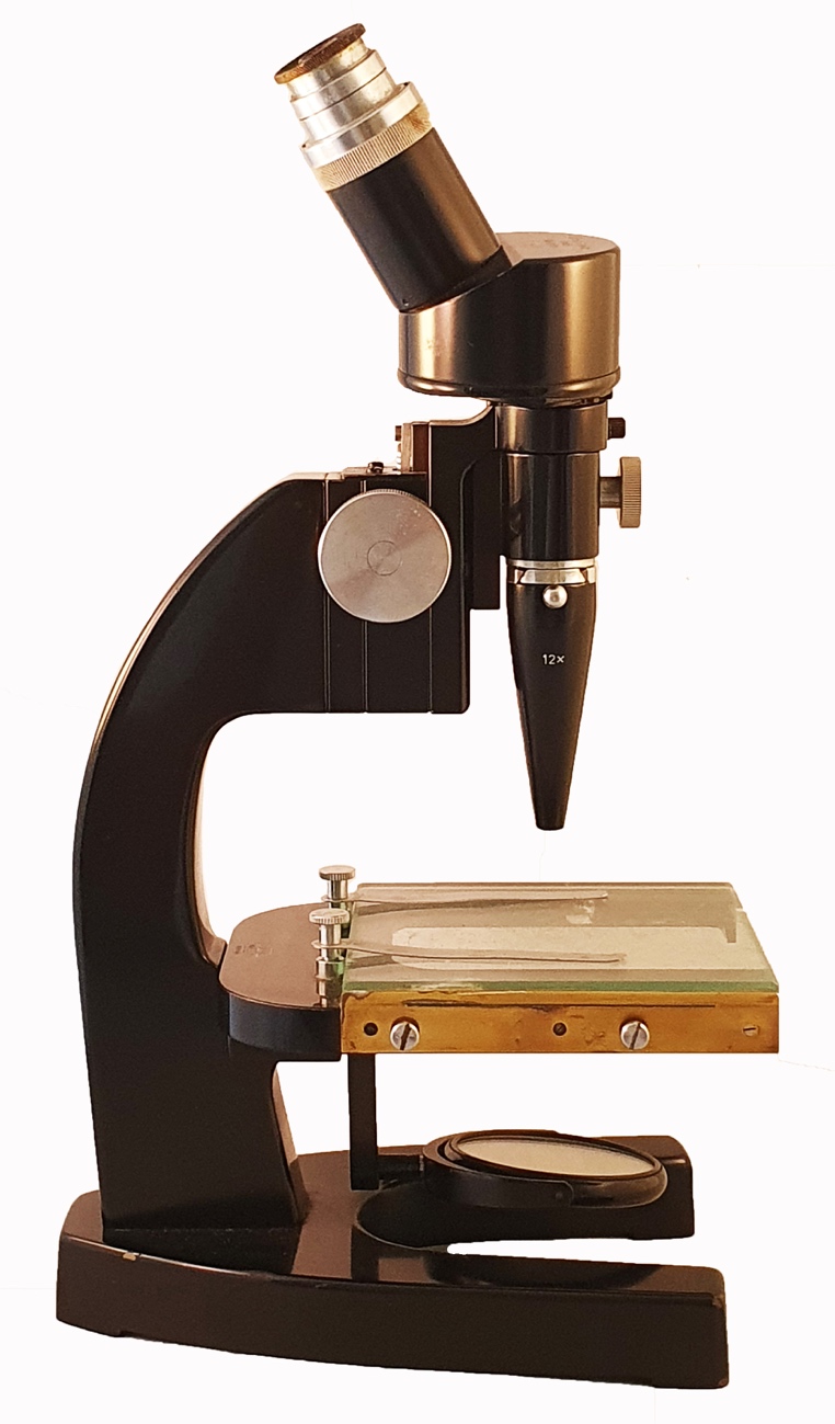 A close-up of a microscopeDescription automatically generated