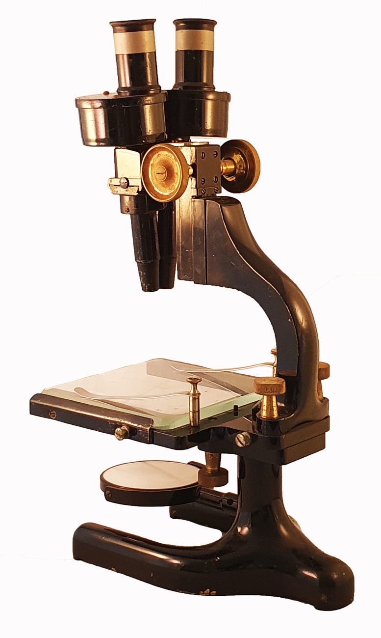 A close-up of a microscopeDescription automatically generated