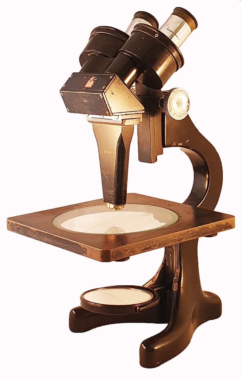 A close-up of a microscopeDescription automatically generated