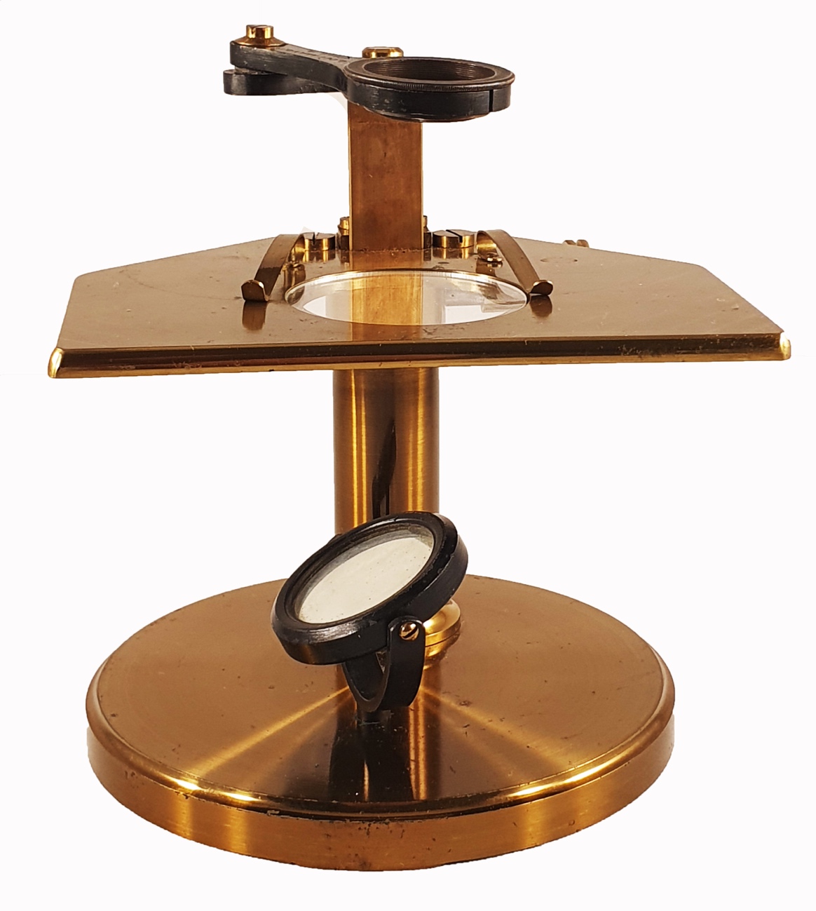 A gold metal device with a magnifying glassDescription automatically ...