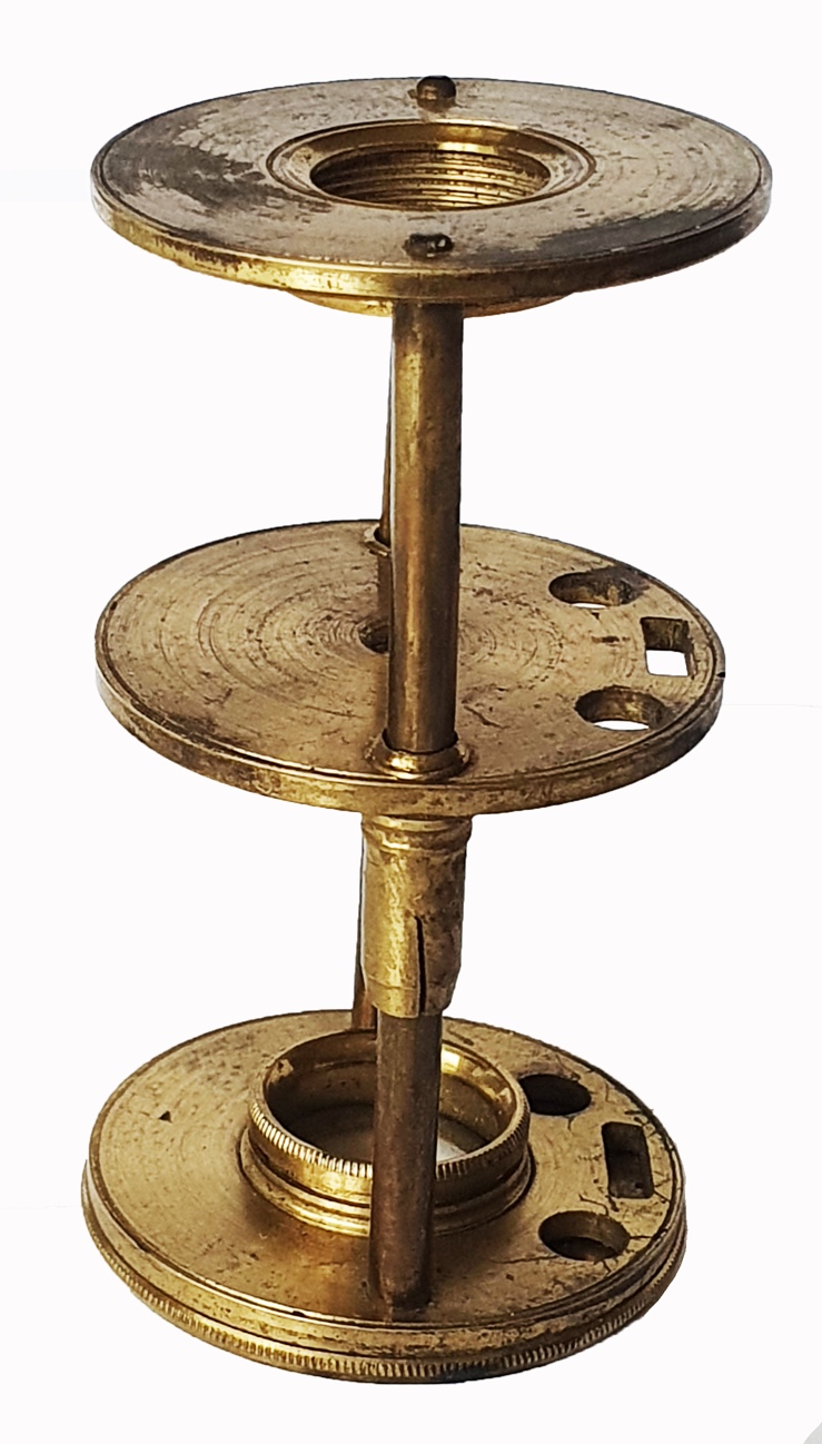 A gold colored metal objectDescription automatically generated with ...